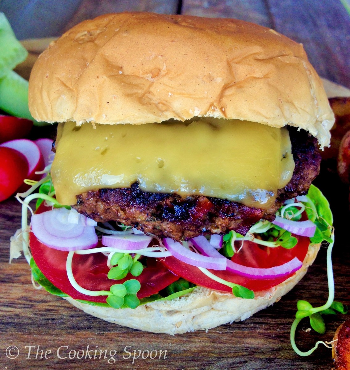 Deluxe Beef burger filled with Onions and Crispy Bacon, topped with ...